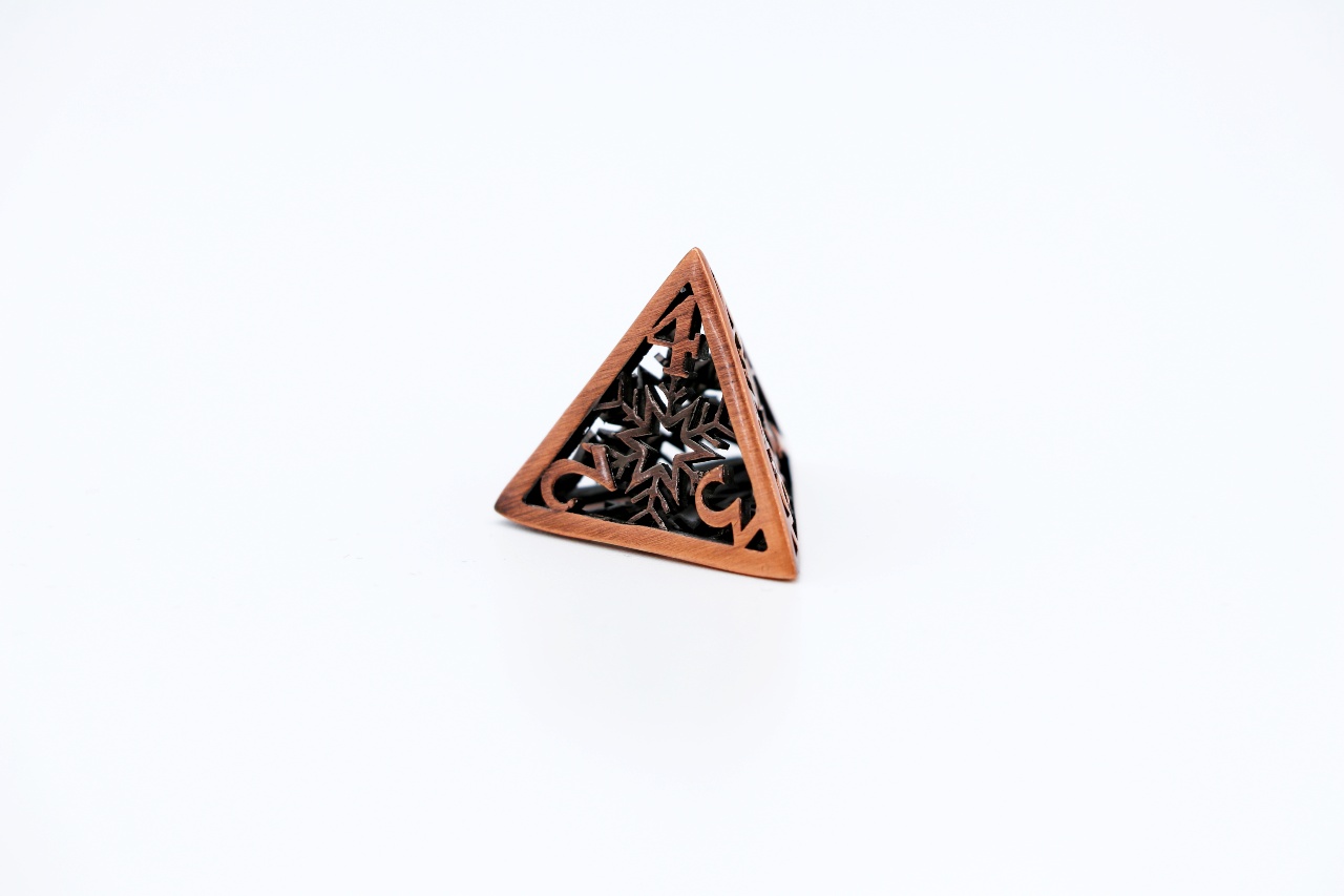 Copper Snowflake Hollow Metal d4 – Bookwyrm Games