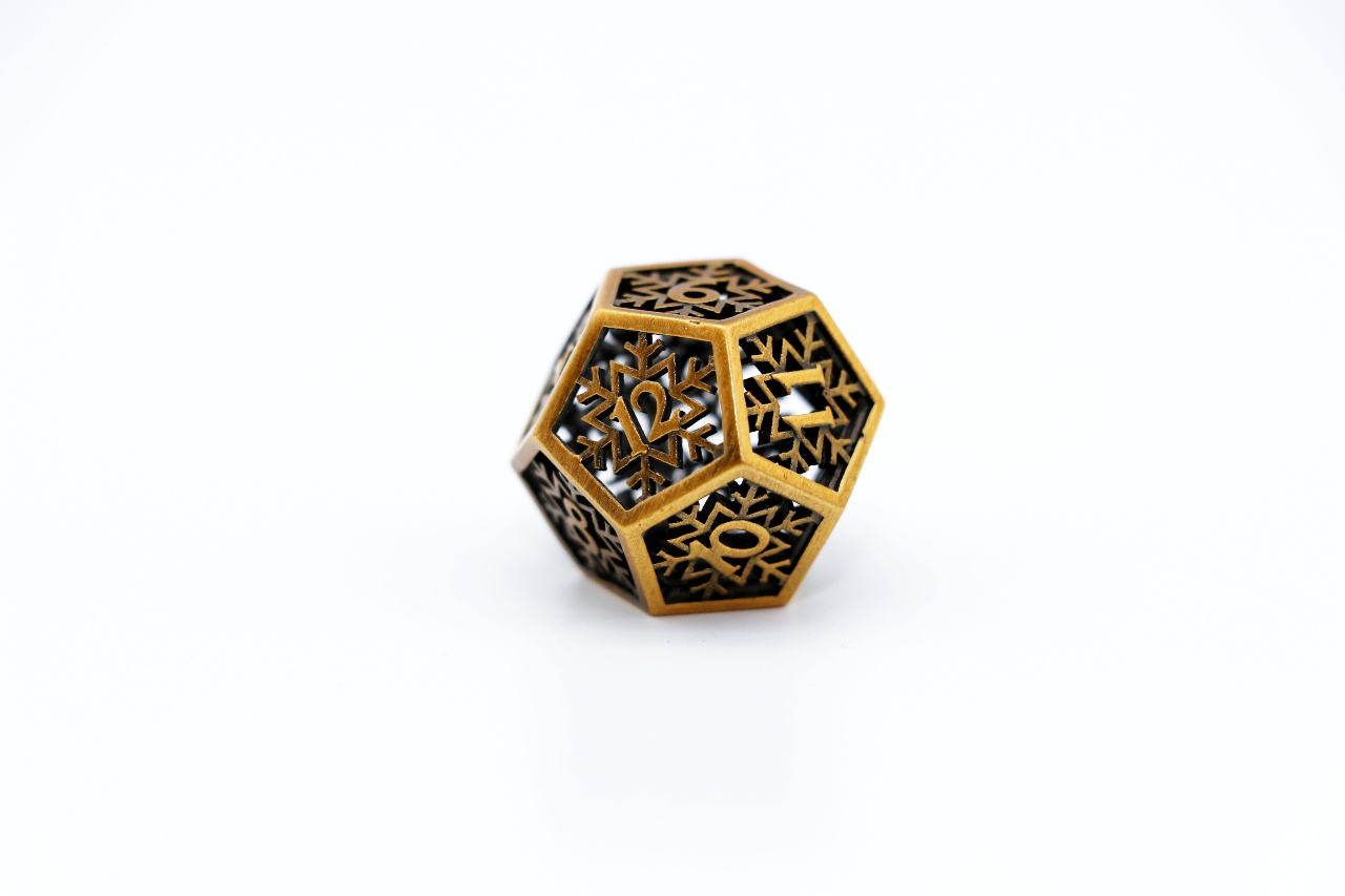 Gold Snowflake Hollow Metal d12 – Bookwyrm Games